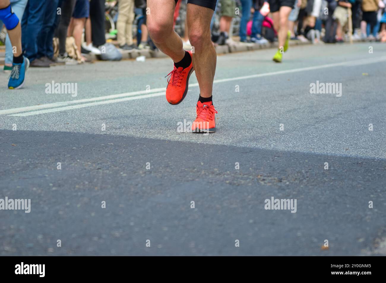 Marathon running race, many runners feet on road racing, sport ...