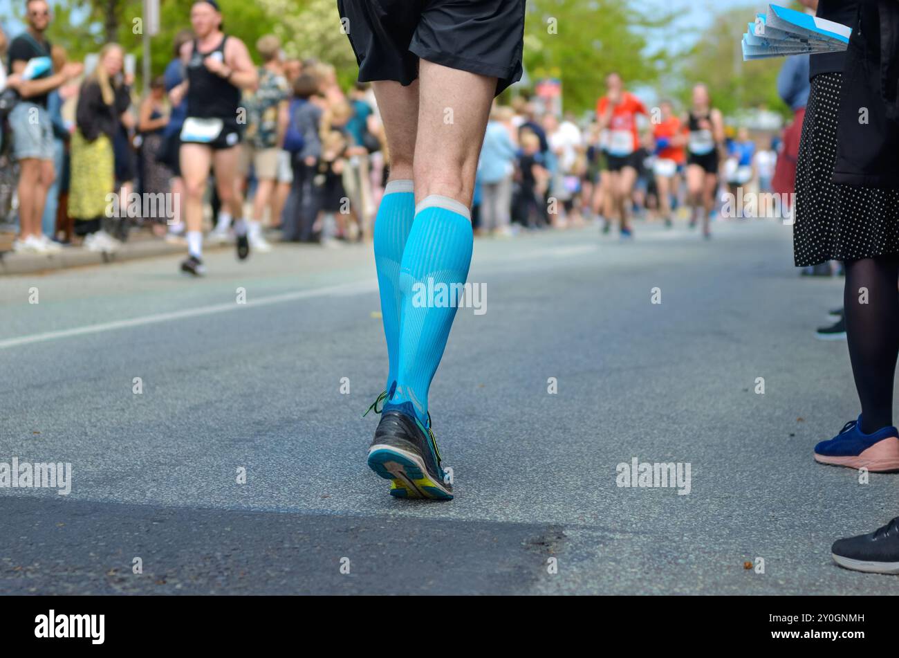 Marathon running race, many runners feet on road racing, sport ...