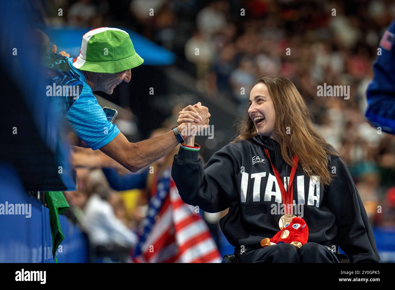 Paralympic athlete Giulia Terzi, of Italy, shakes hands with a ...