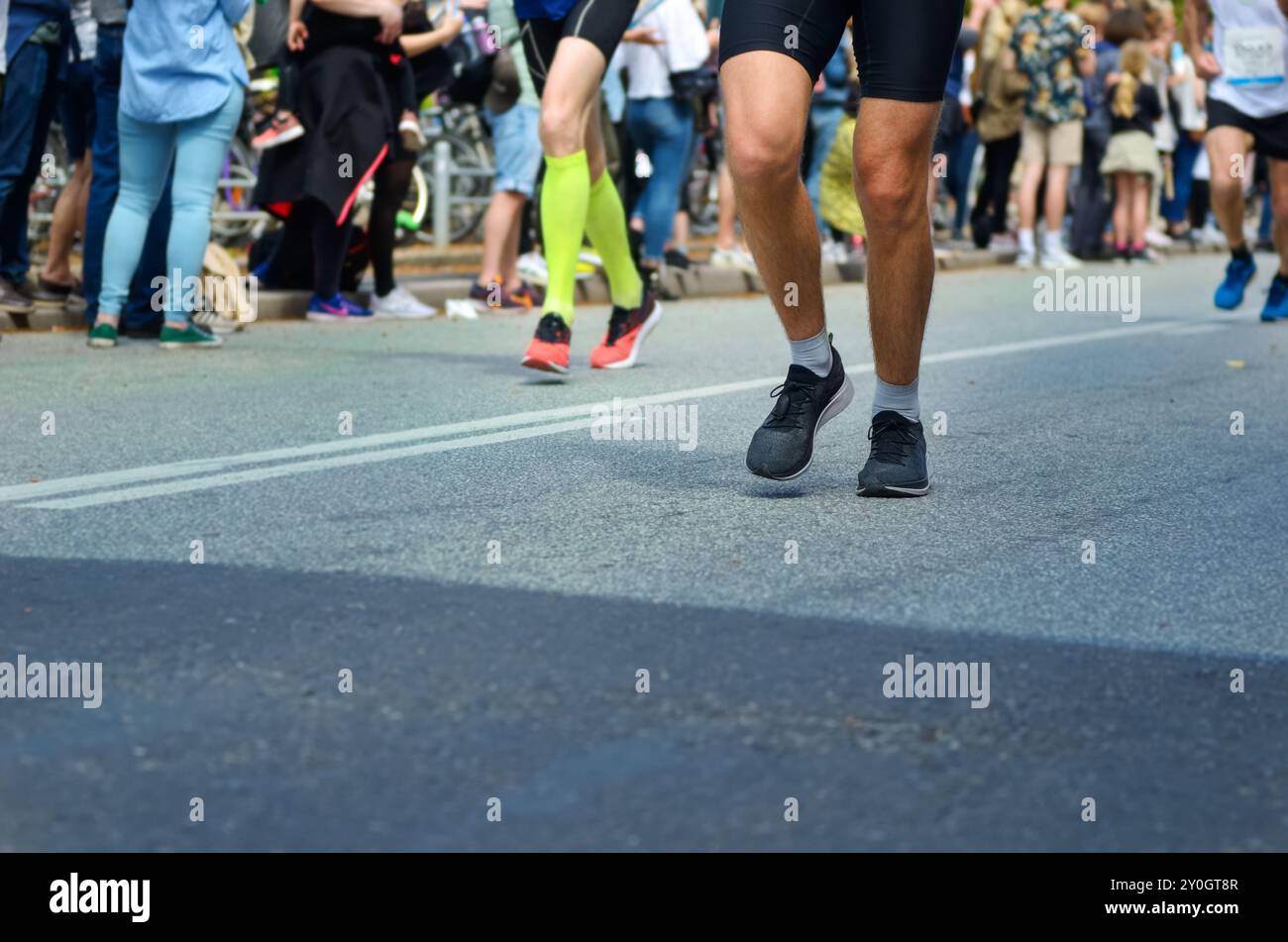 Marathon running race, many runners feet on road racing, sport ...
