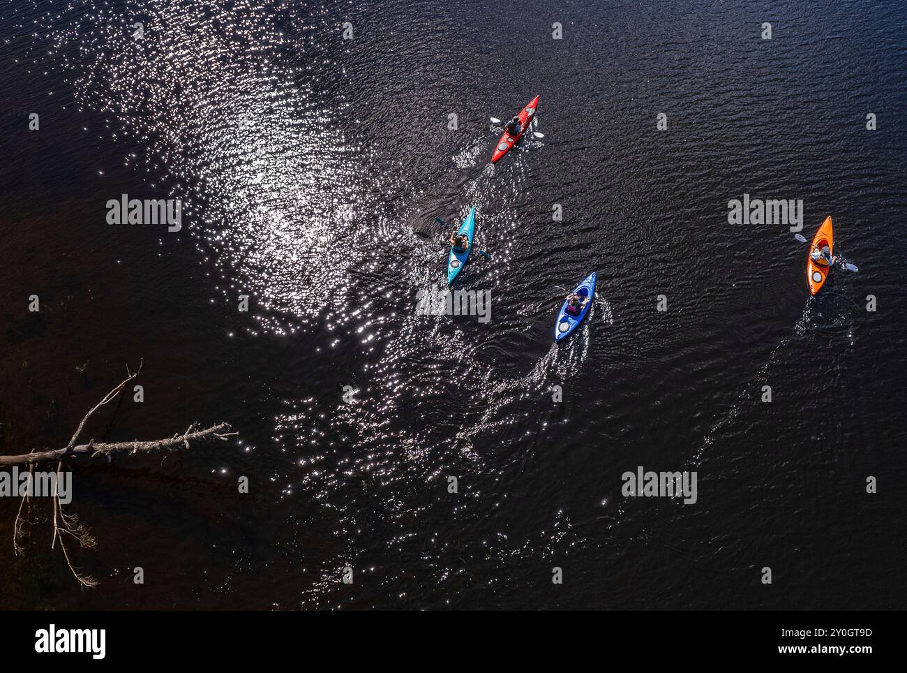 Kayakers Justin LaFontaine, top left, is followed by his wife, Erica ...