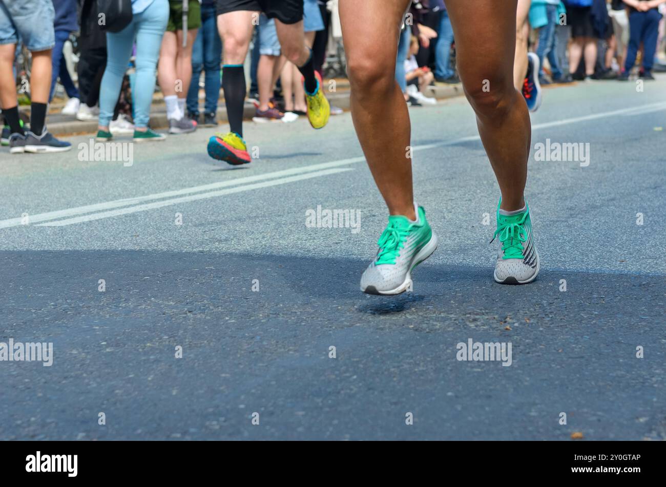 Marathon running race, many runners feet on road racing, sport ...