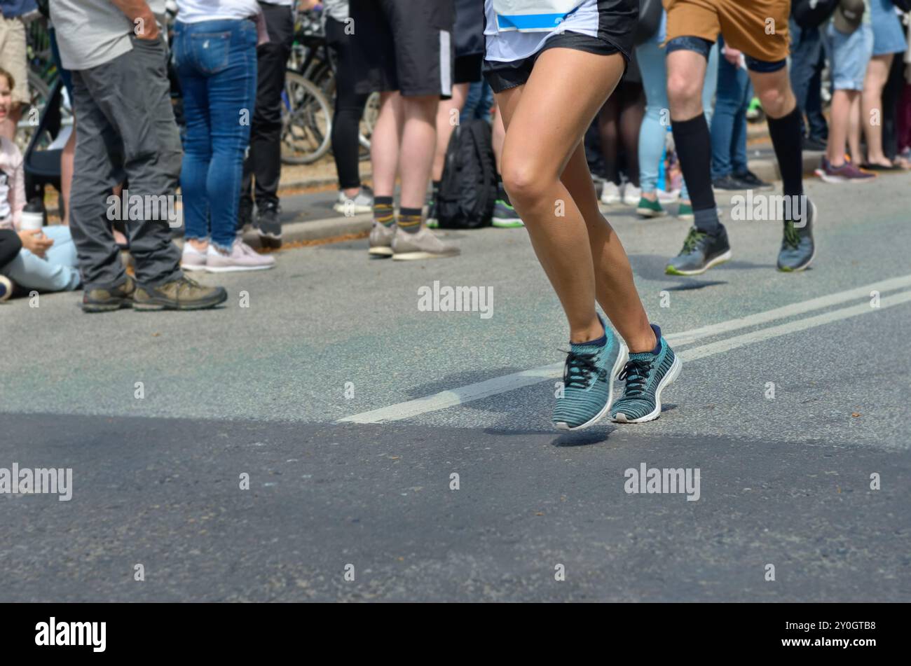 Marathon running race, many runners feet on road racing, sport ...