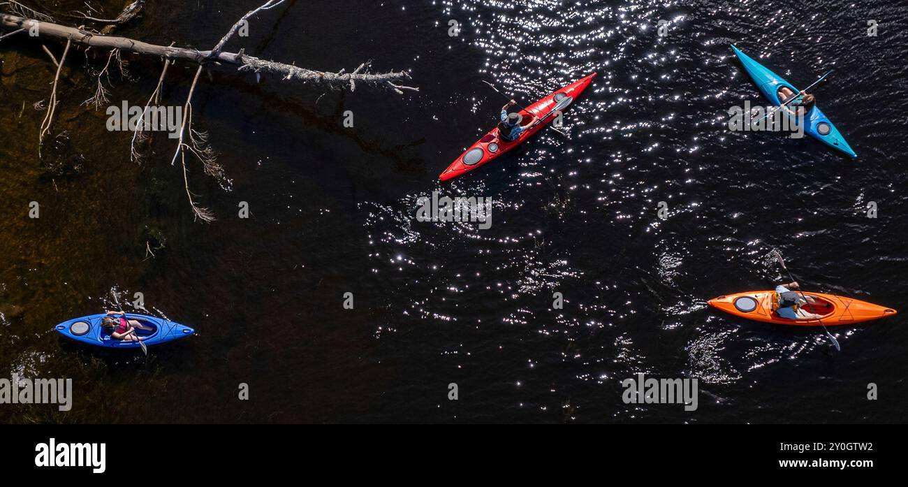 Ethel LaFlamme, bottom left, paddles with her husband Jim, bottom right ...