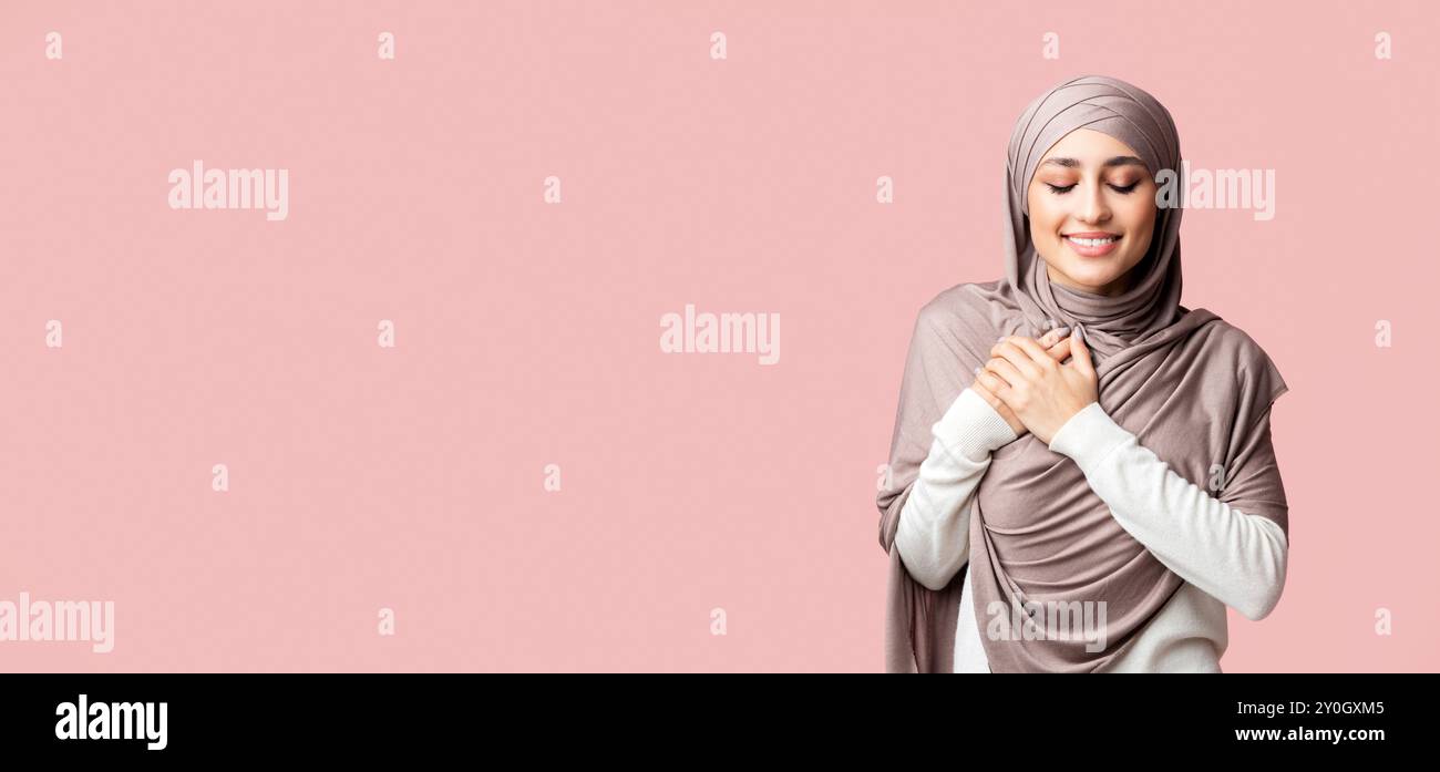 Grateful muslim girl keeping both palms on chest, expressing ...