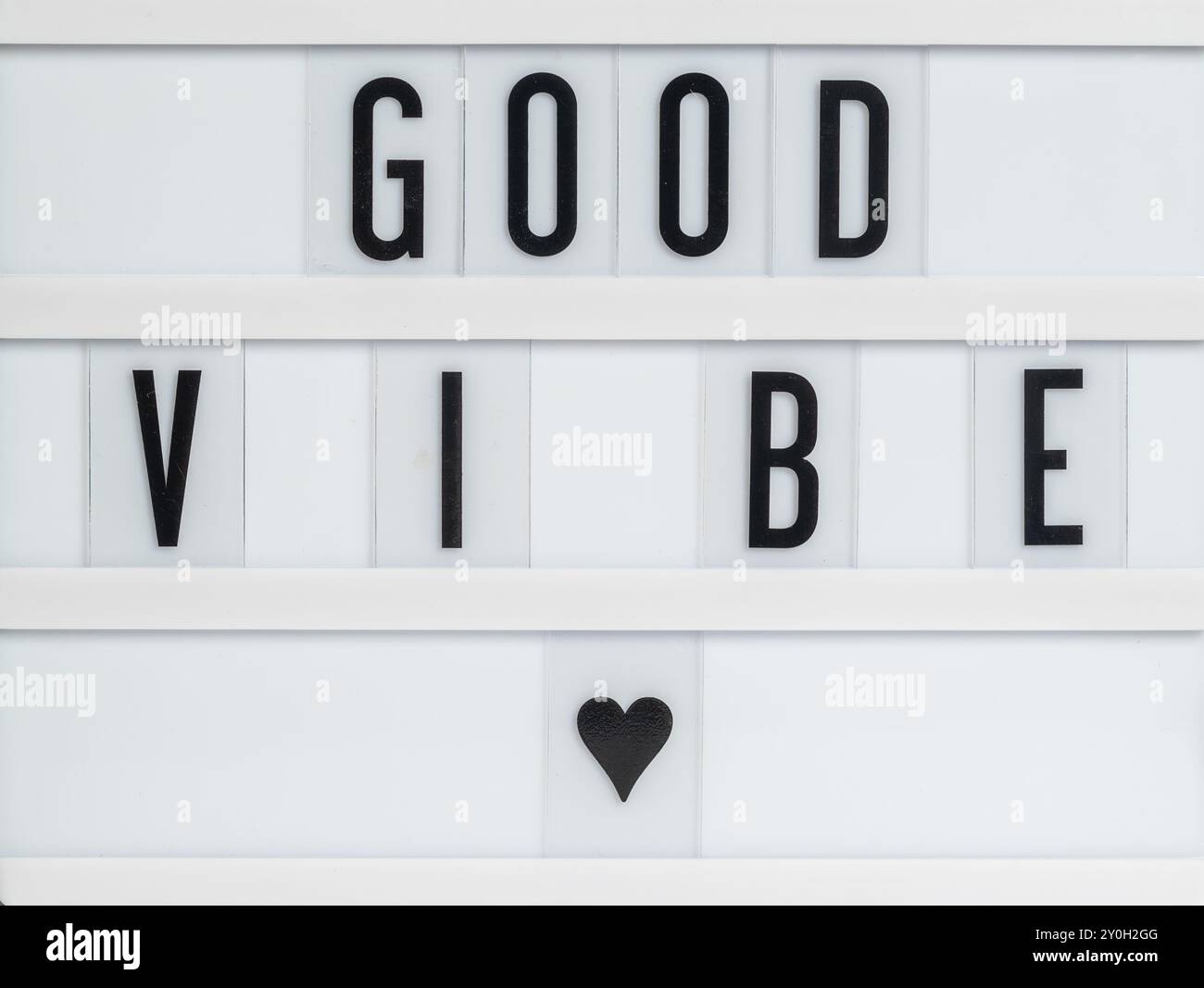 White message board with the message Good Vibe with a heart below it ...