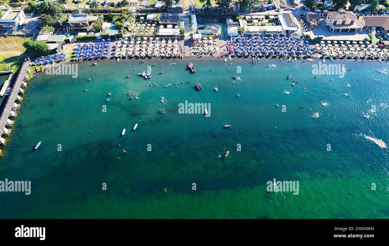 Aerial view of people swimming and sunbathing at beach resort Stock ...
