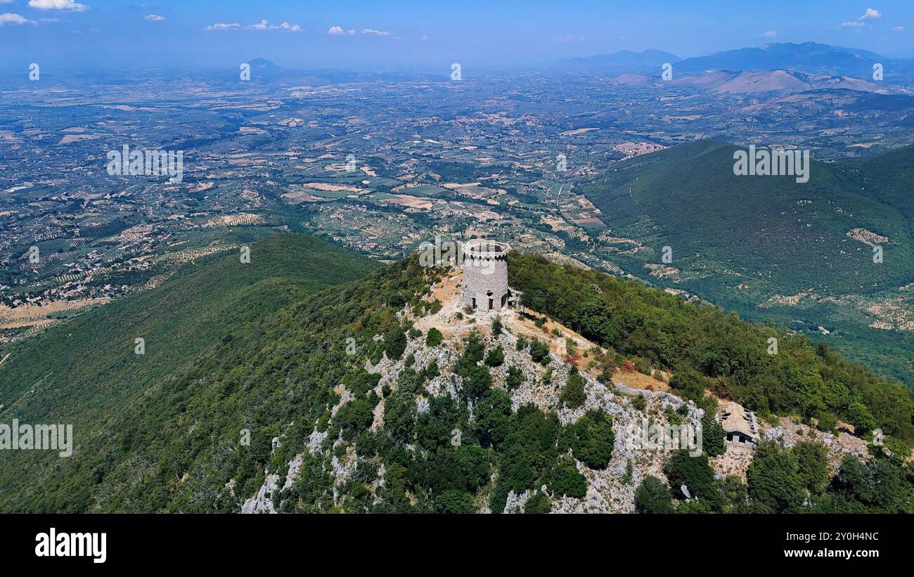 Ancient stone tower overlooking vast landscape in italy Stock Photo - Alamy