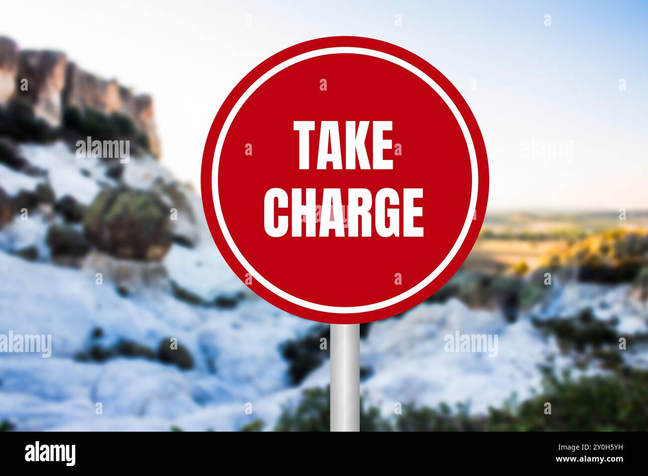 Take charge message written on red round sign on nature background ...