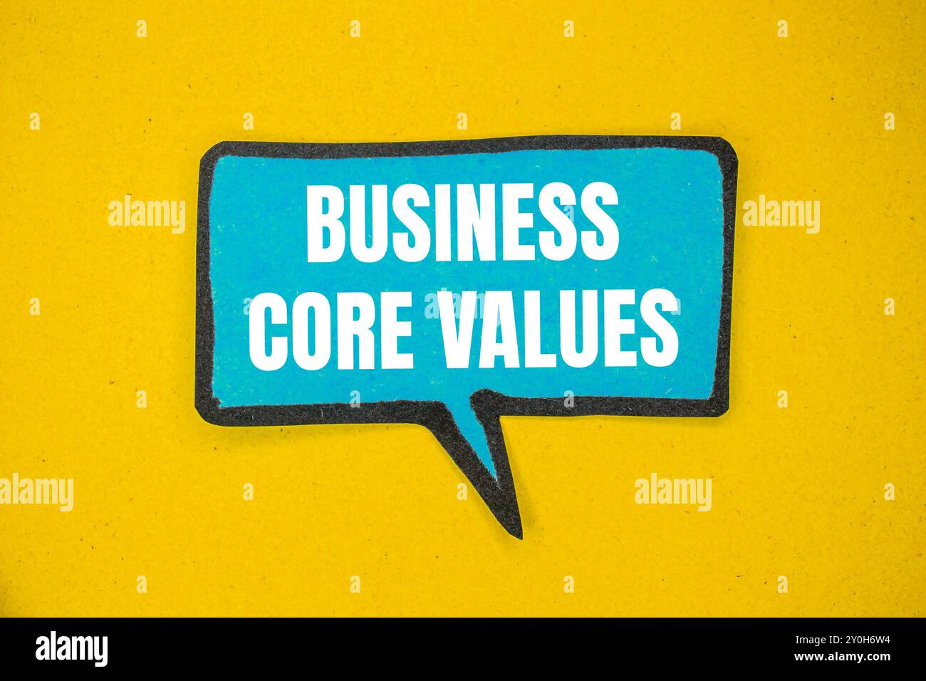 Business core values message written on blue paper speech bubble with ...