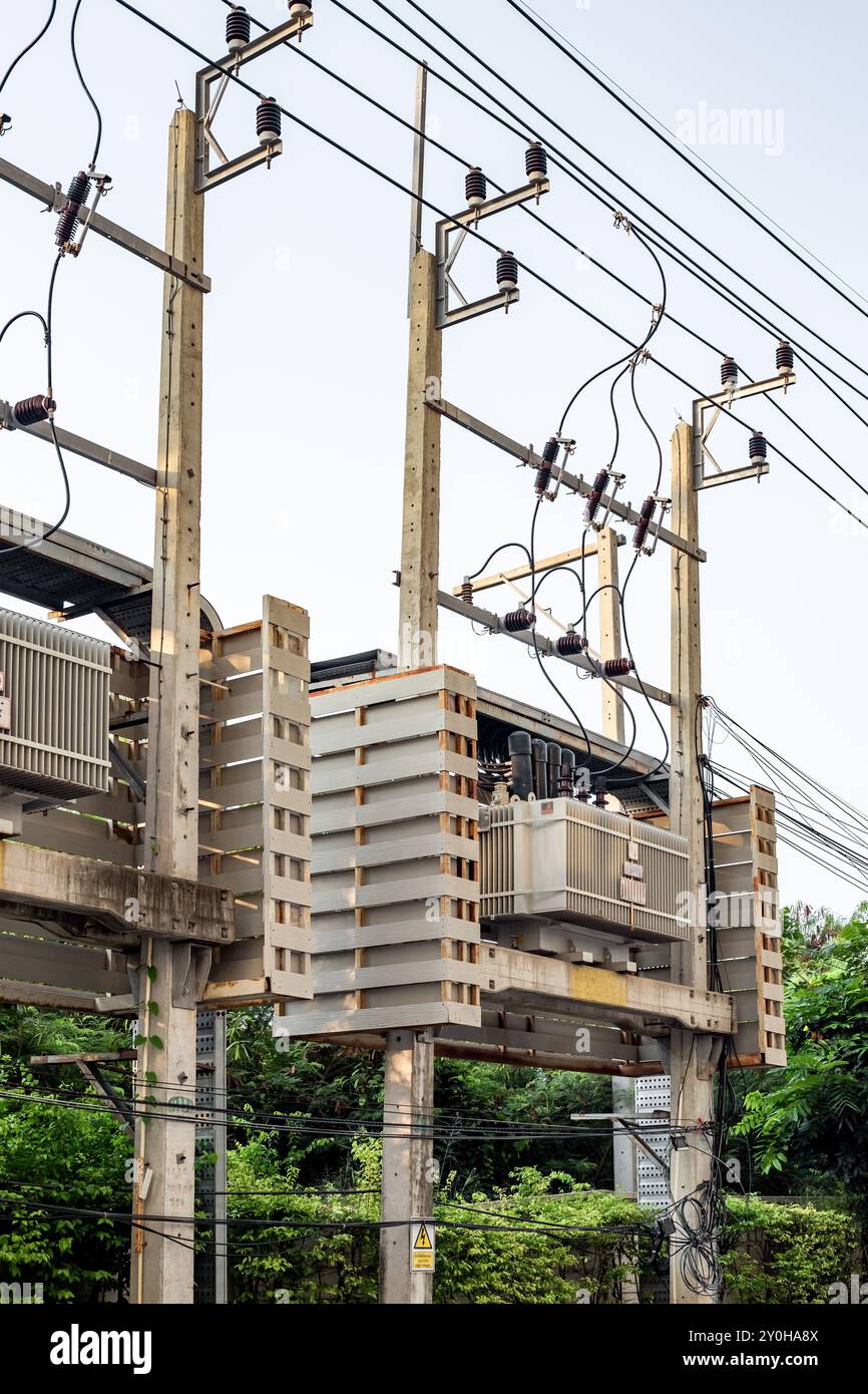 High voltage transformers with wires that convert electricity. Power ...