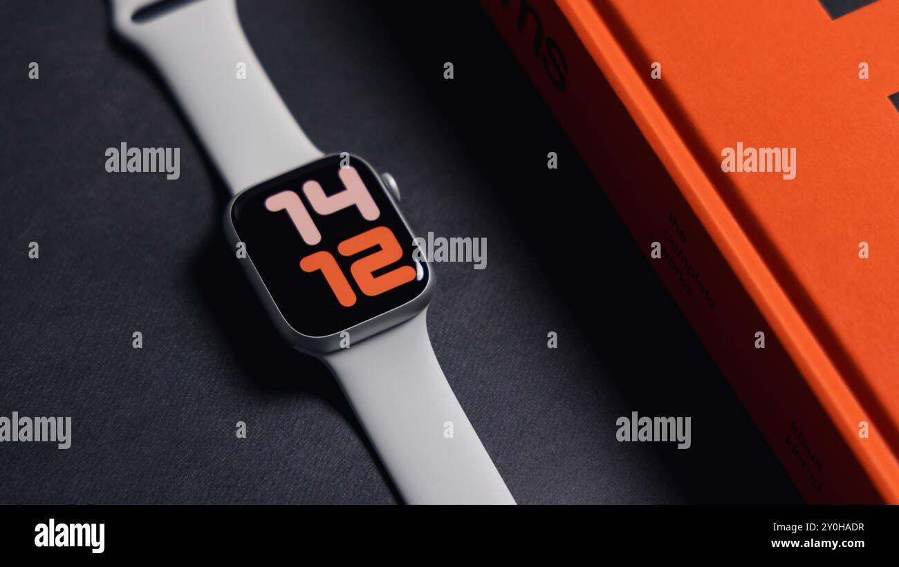 LONDON - AUGUST 26, 2024: Apple Watch with white band strap and time ...
