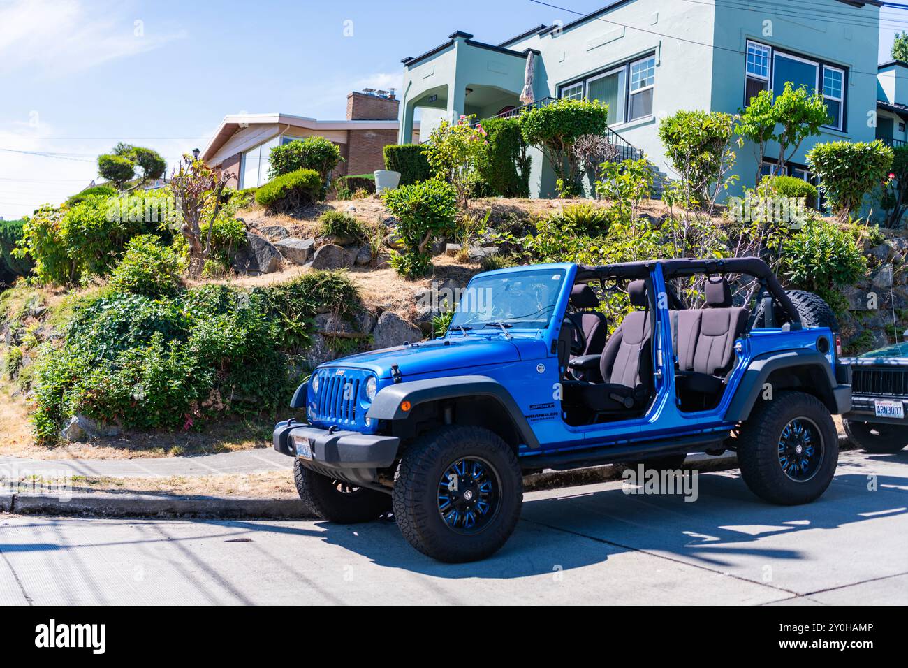 Seattle, WA, USA -July 3, 2024: jeep wrangler jk trail blue side corner ...