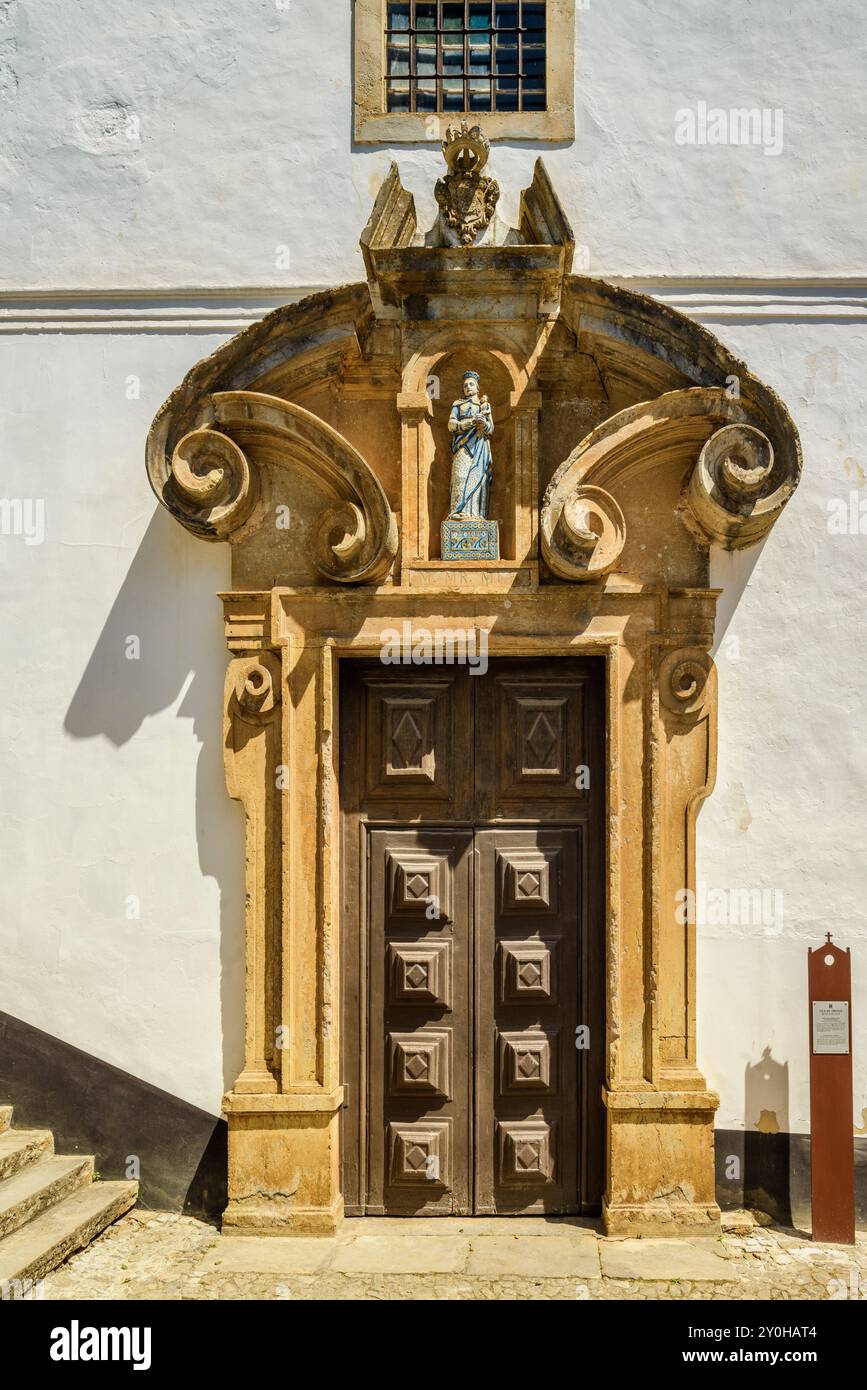 Door on the facade of the church of the Holy House of Mercy in Óbidos ...
