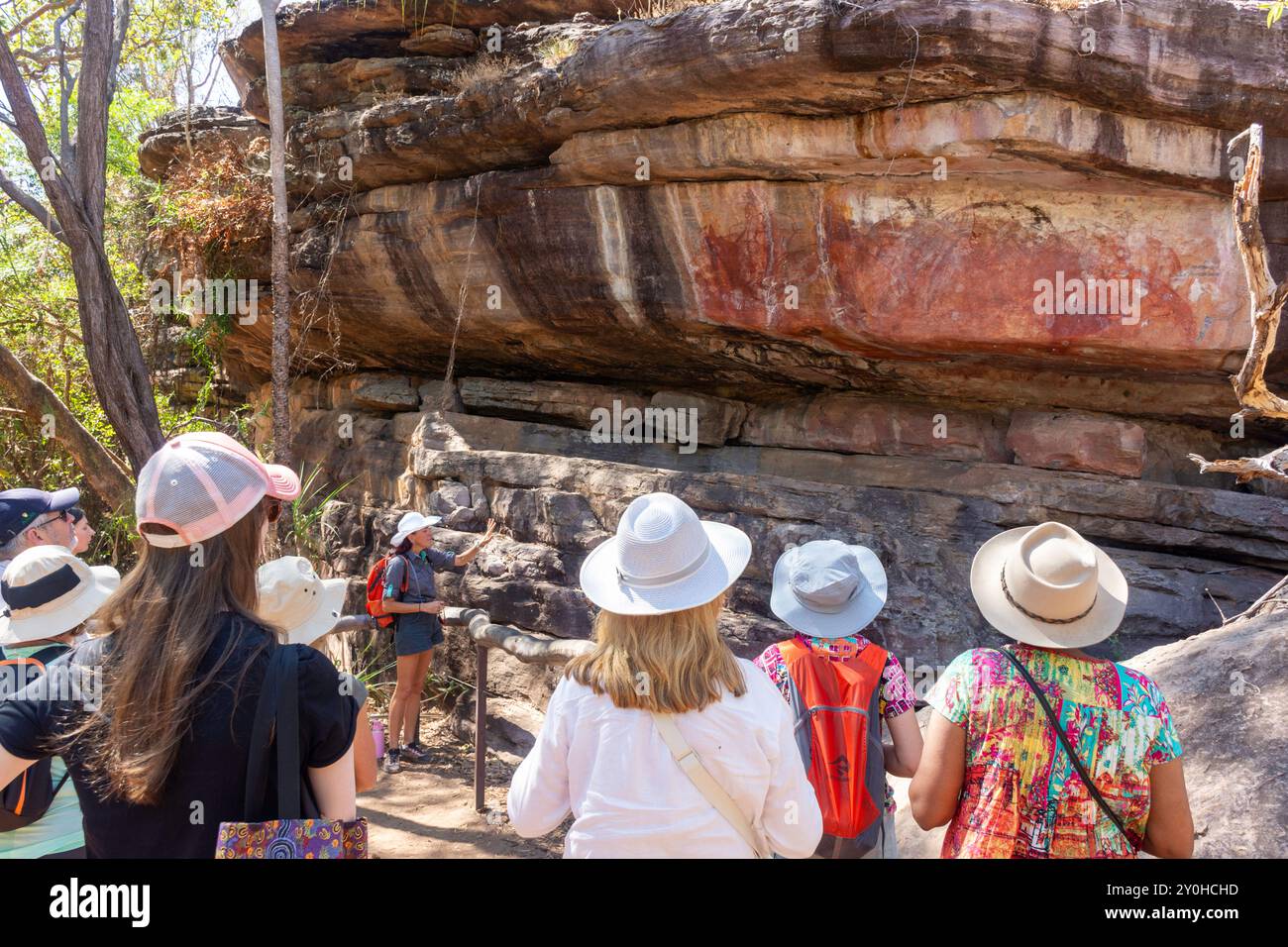 Group observing The Ubirr Aboriginal rock art site, Kakadu National Park, Kakadu Highway, Jabiru ...
