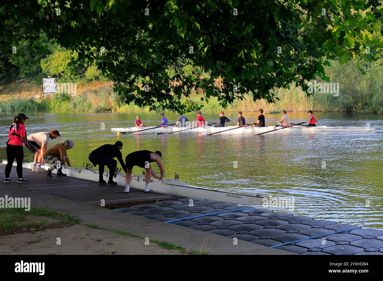 Coxed eight shell scull (eight-man crew with single oars) cox. River ...