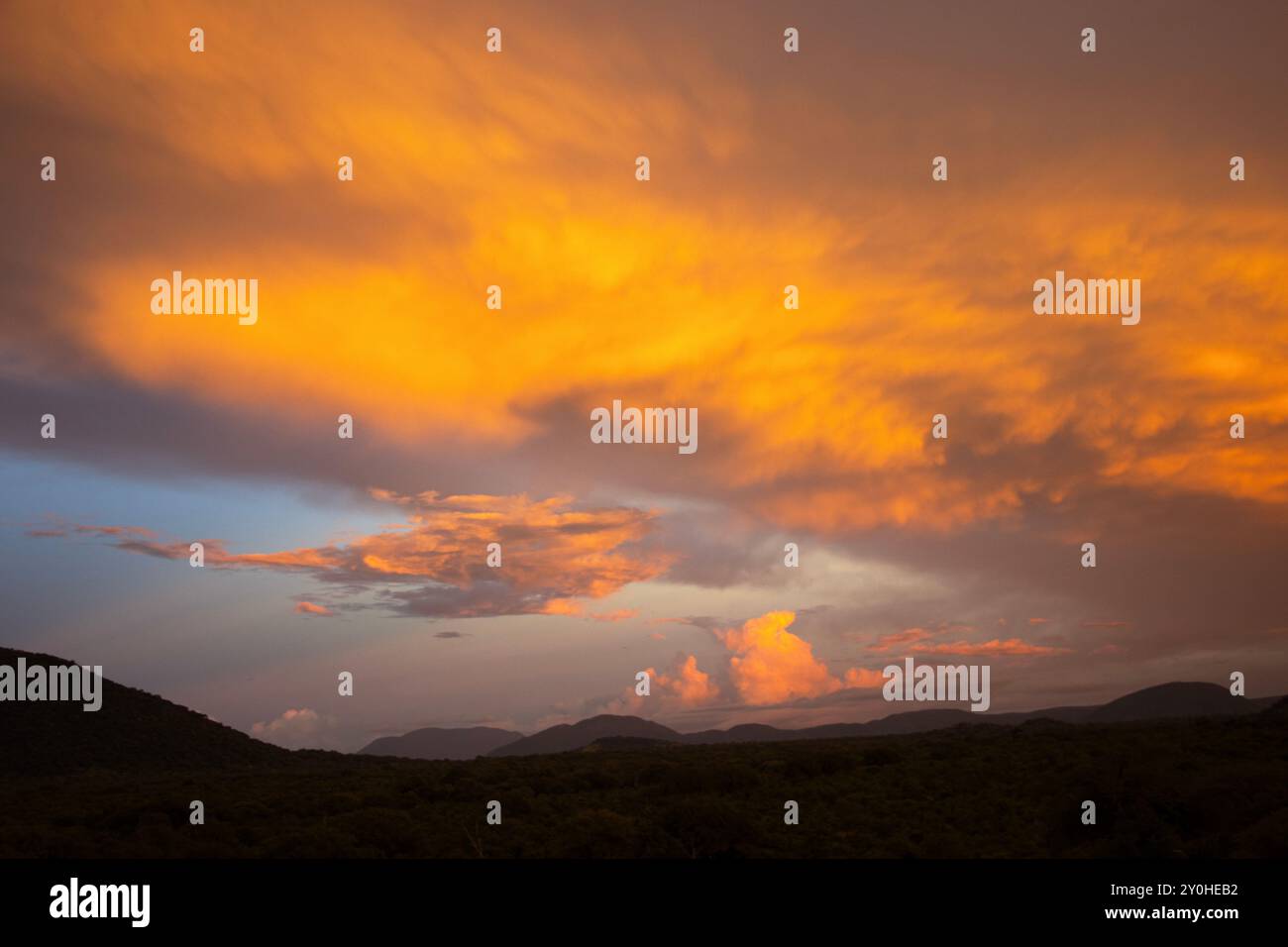 The late evening light sets the clouds glowing in a spectacular show ...