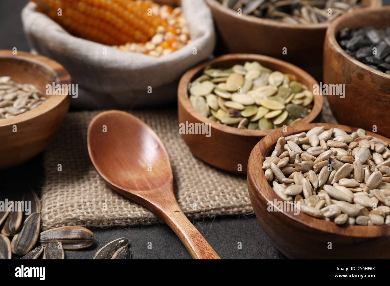 Different types of seeds and legumes on grey table Stock Photo - Alamy