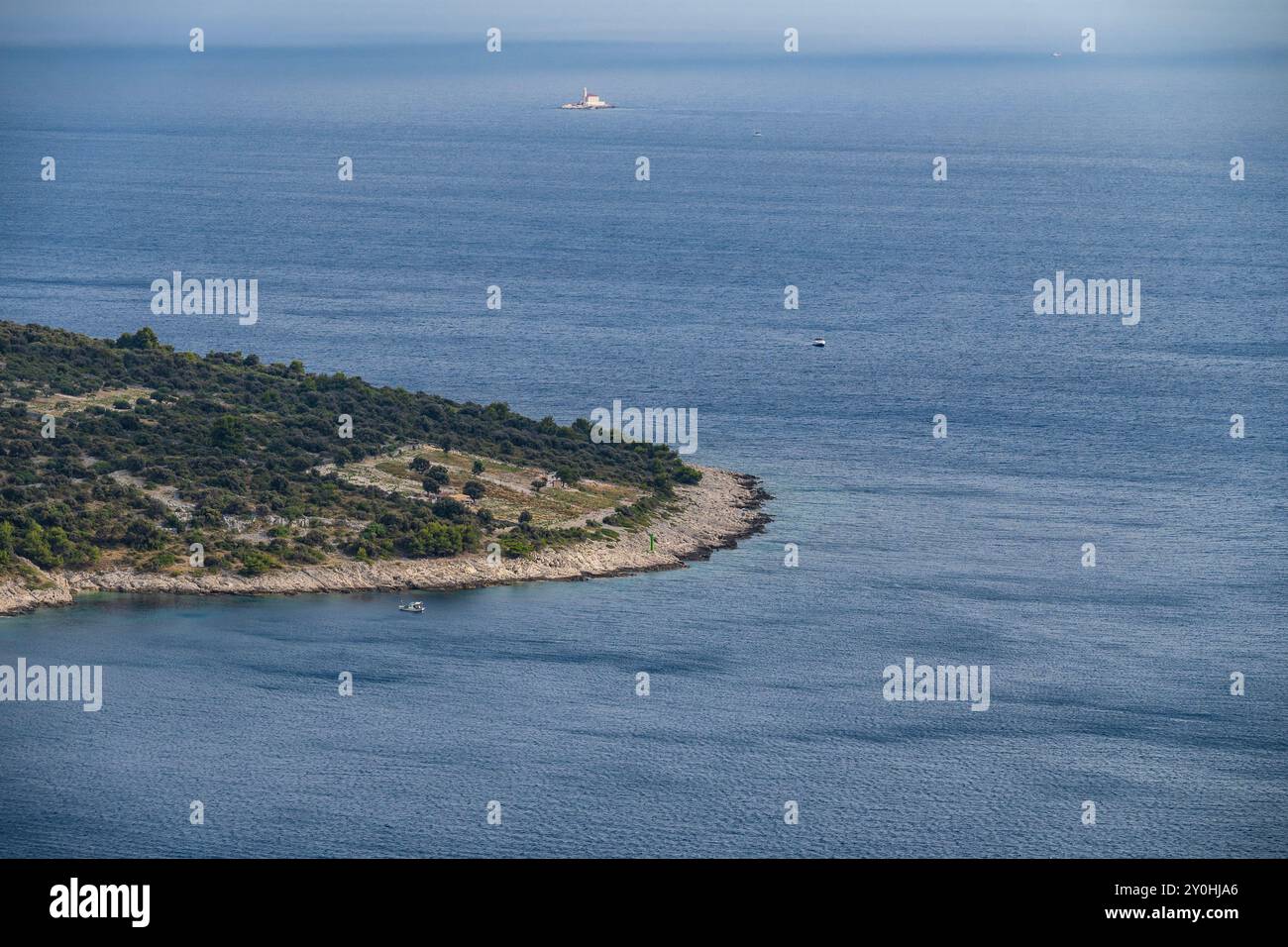 Aerial view of solitary house built on the rough beach near town of ...
