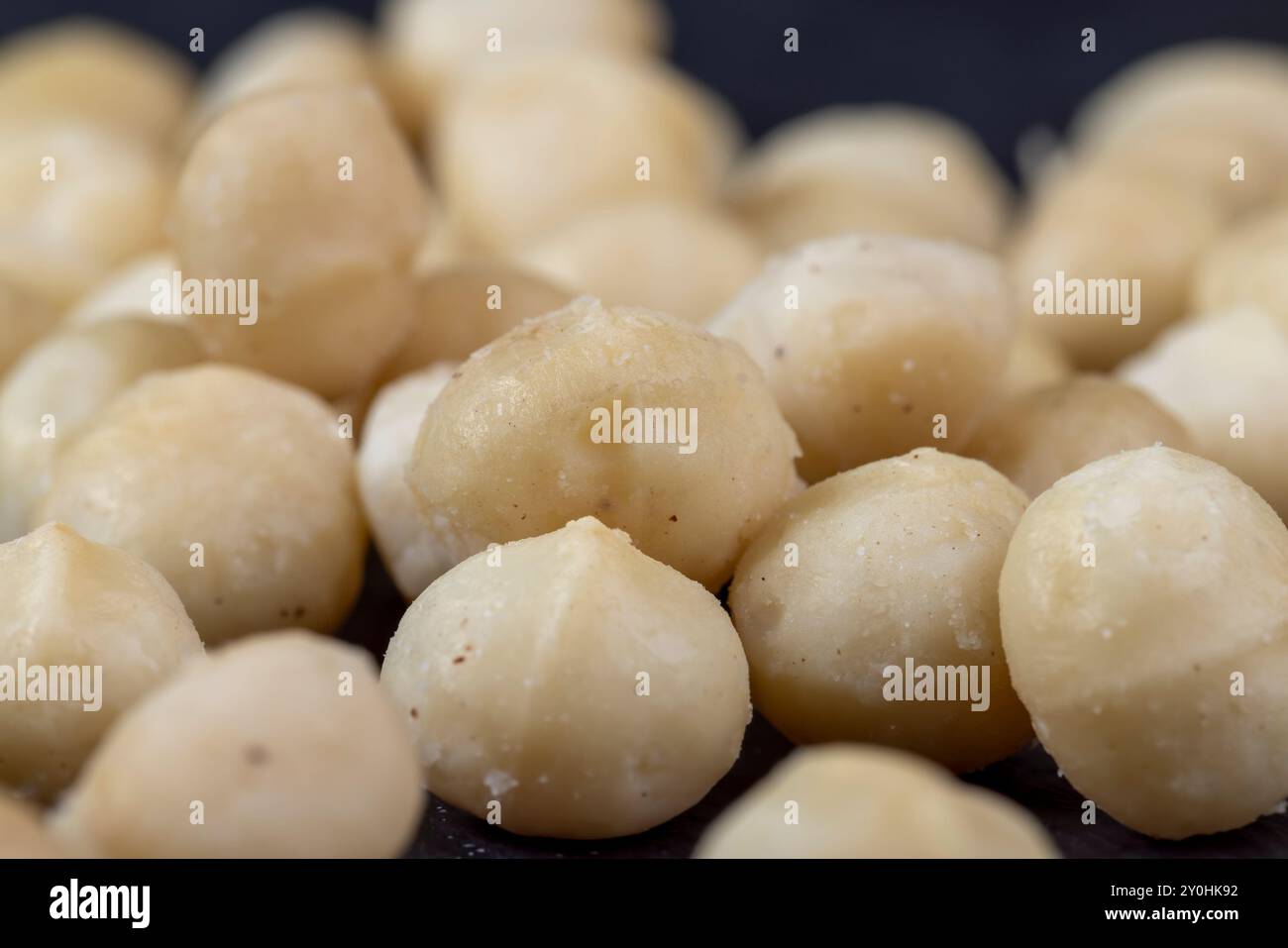 Peeled macadamia nuts on the table, crispy dried macadamia nuts peeled ...