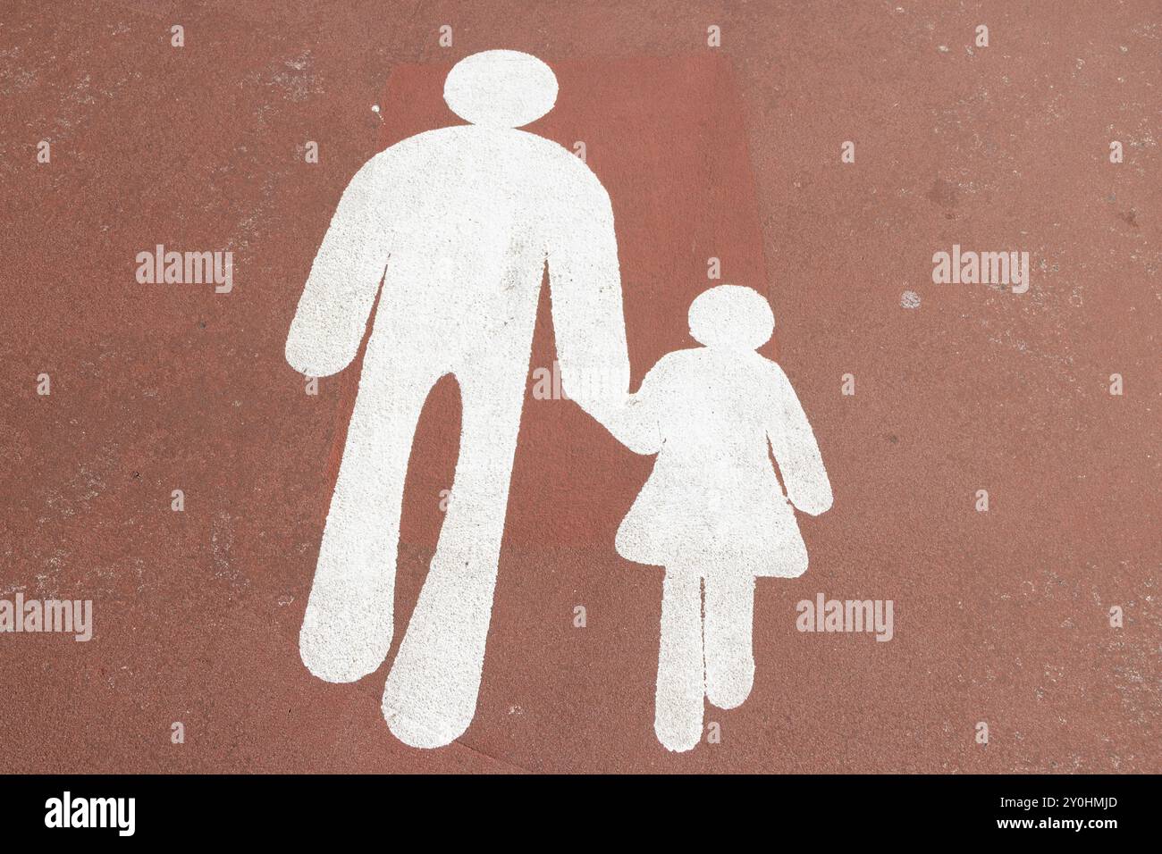 White pedestrian sign painted on a red ground is reminding pedestrians ...