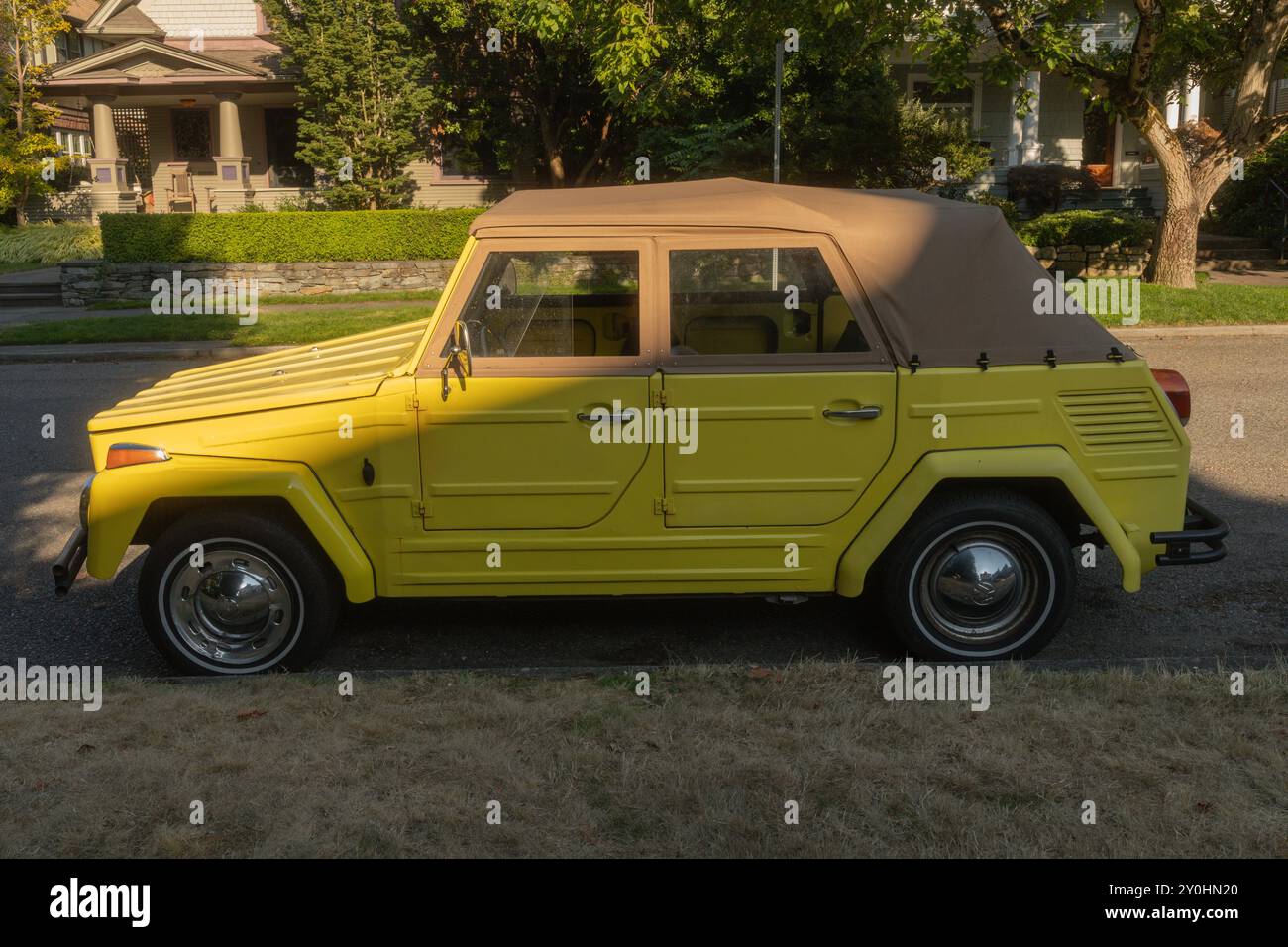 yellow Type 181 Volkswagen parked on the street in residential ...