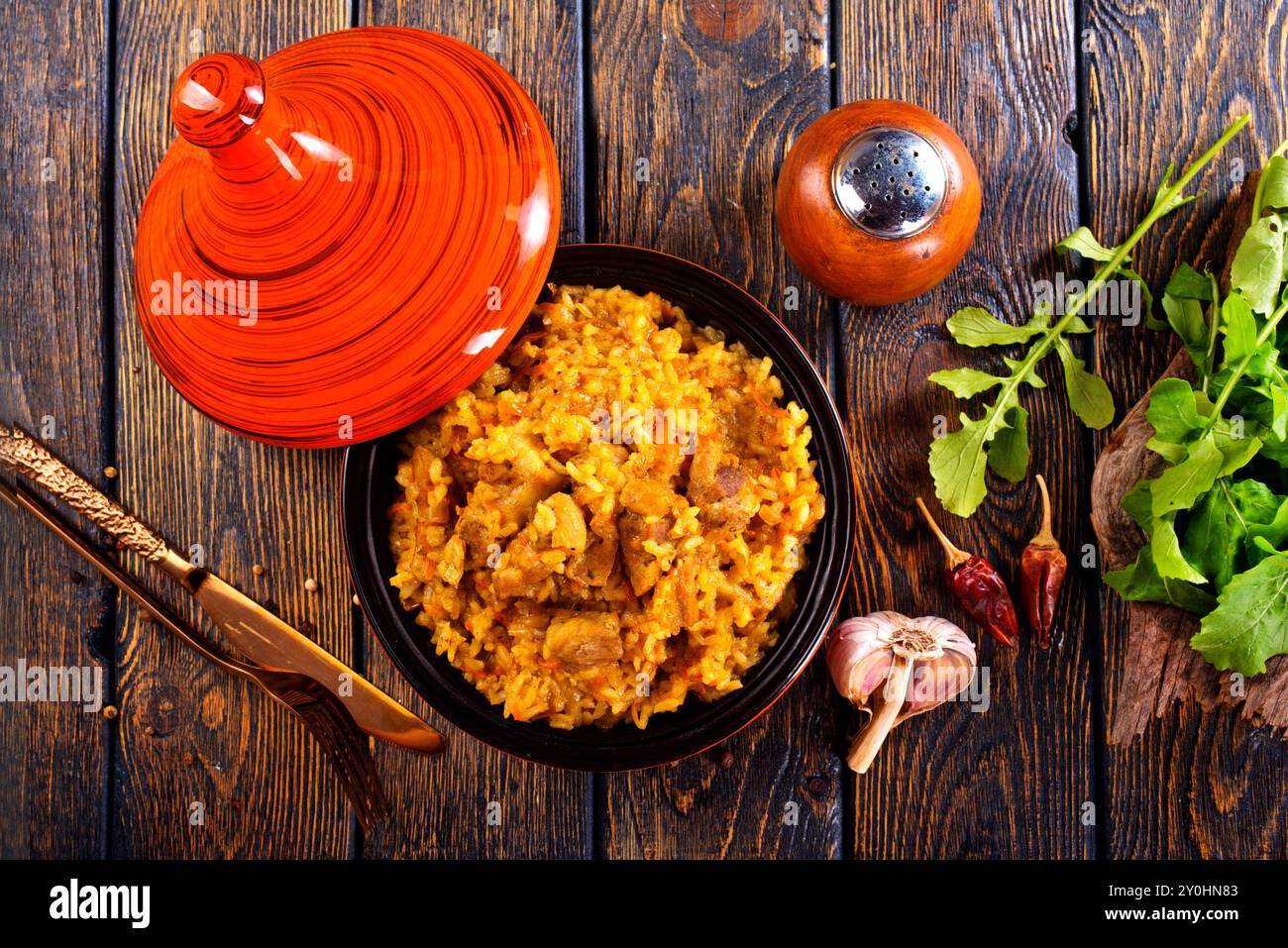 Uzbek cuisine food pilaf, rice with carrots, vegetable oil, raisins ...