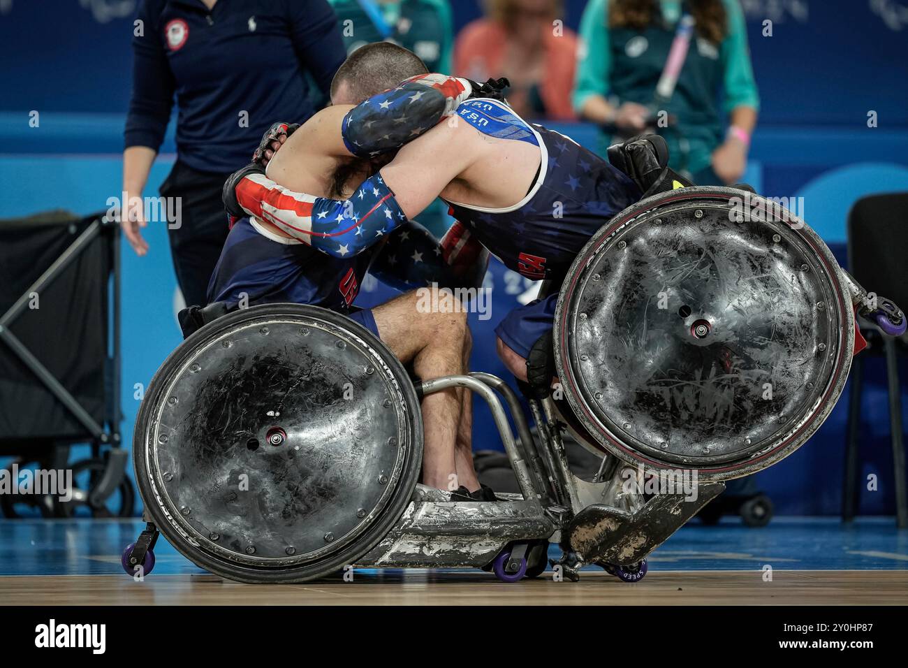 Josh Wheeler of the U.S. and Chuck Aoki of the U.S. hug to console each ...