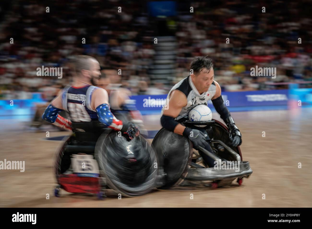 Japan's Yukinobu Ike holds the ball away from Josh Wheeler of the U.S ...