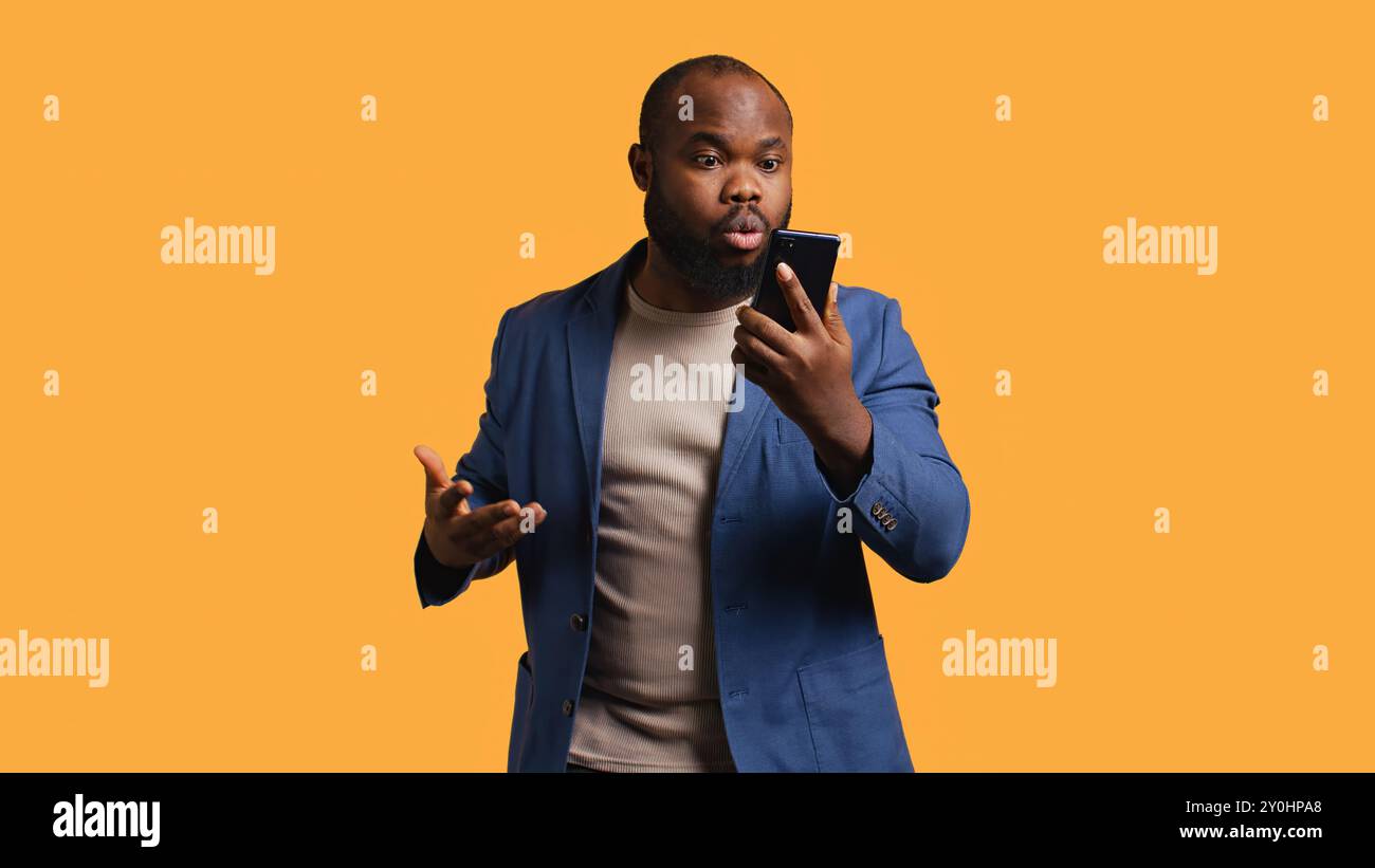 Irked african american man fighting with friends during telephone call ...