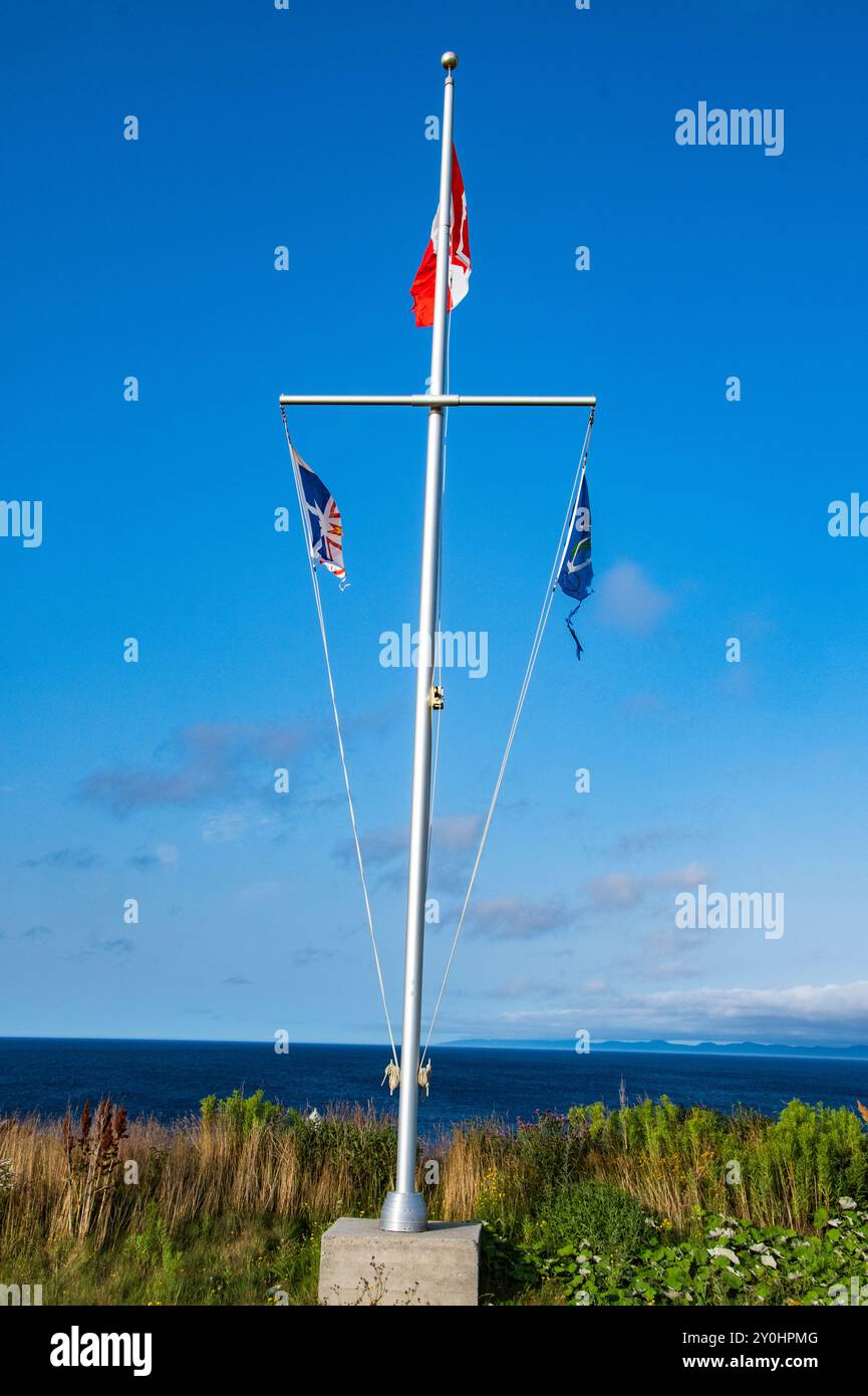 Flags flying at Green Point Lighthouse in Port de Grave, Newfoundland ...