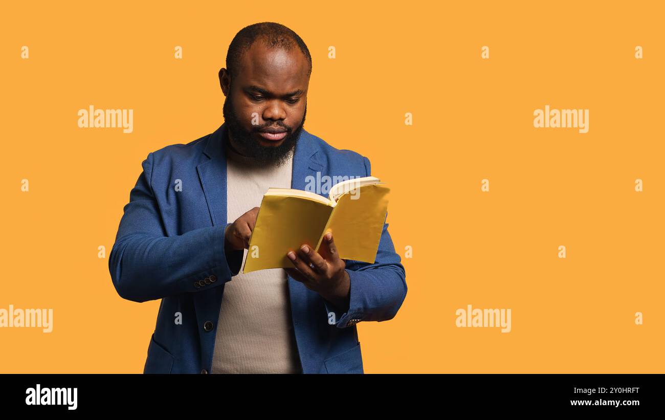 Man struggling to read book with small font, pointing finger to words ...