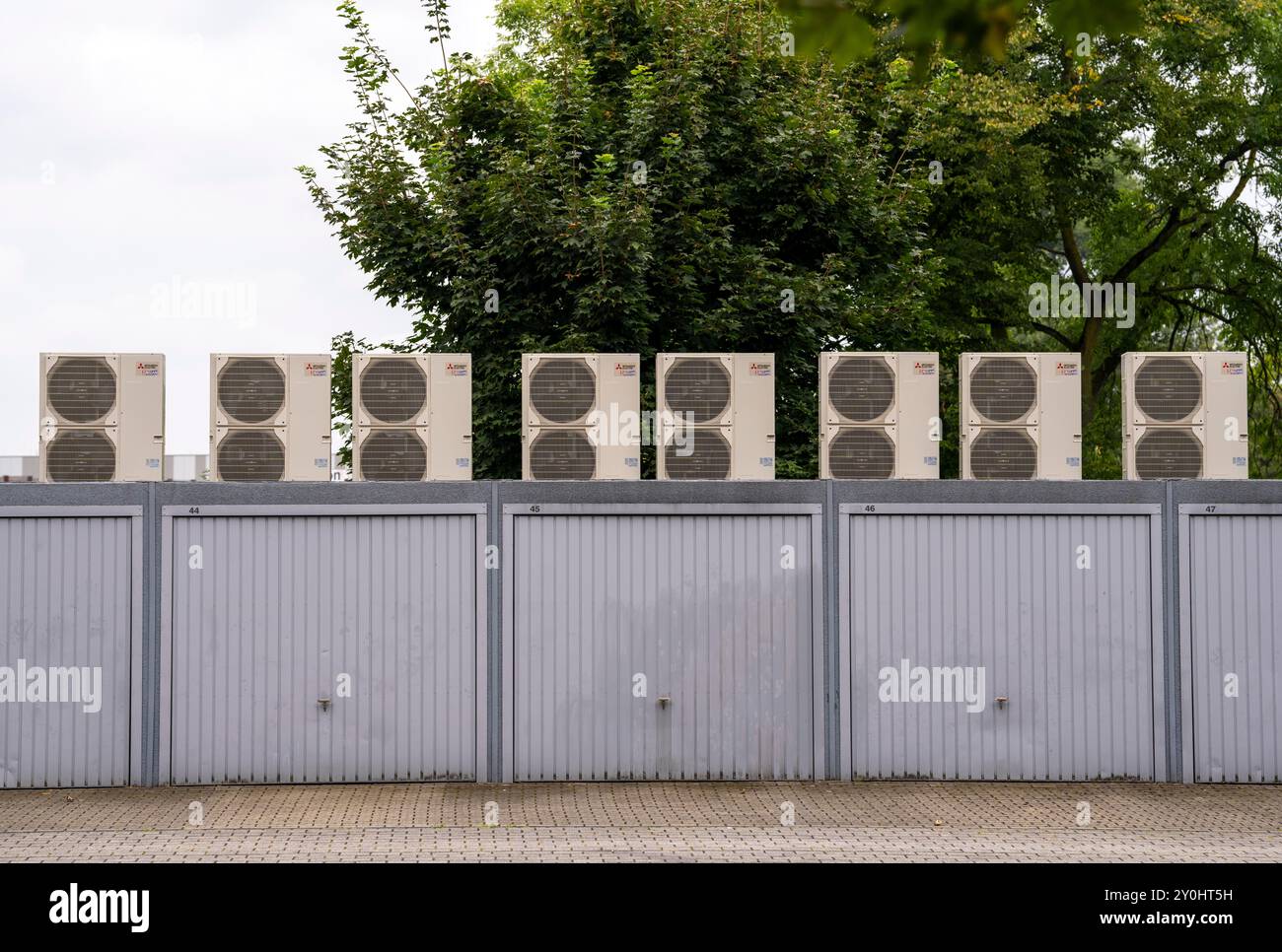 Heat pumps in a residential area, multi-family houses are supplied with ...