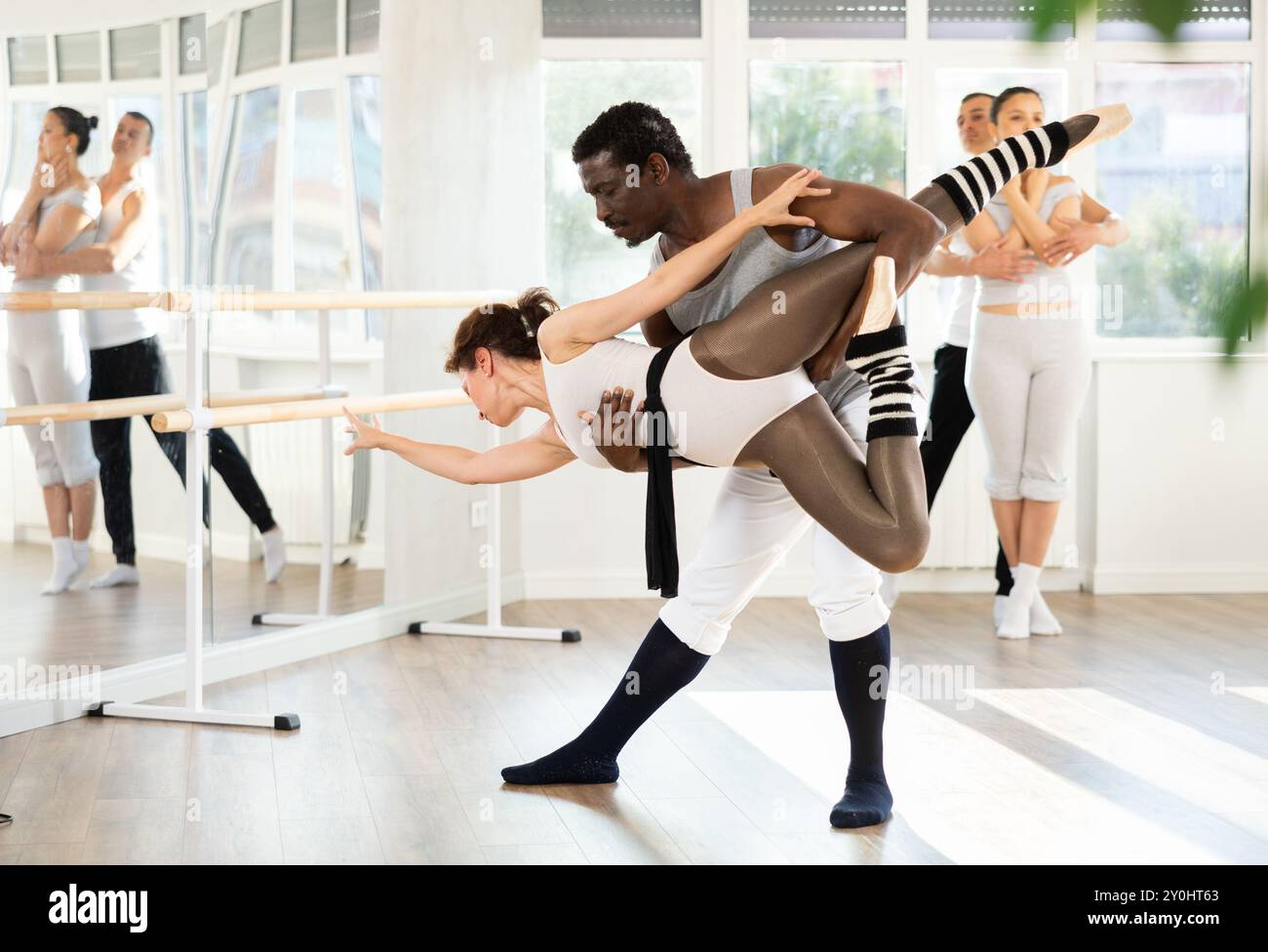 Adult man and adult woman rehearsing pair ballet Stock Photo - Alamy