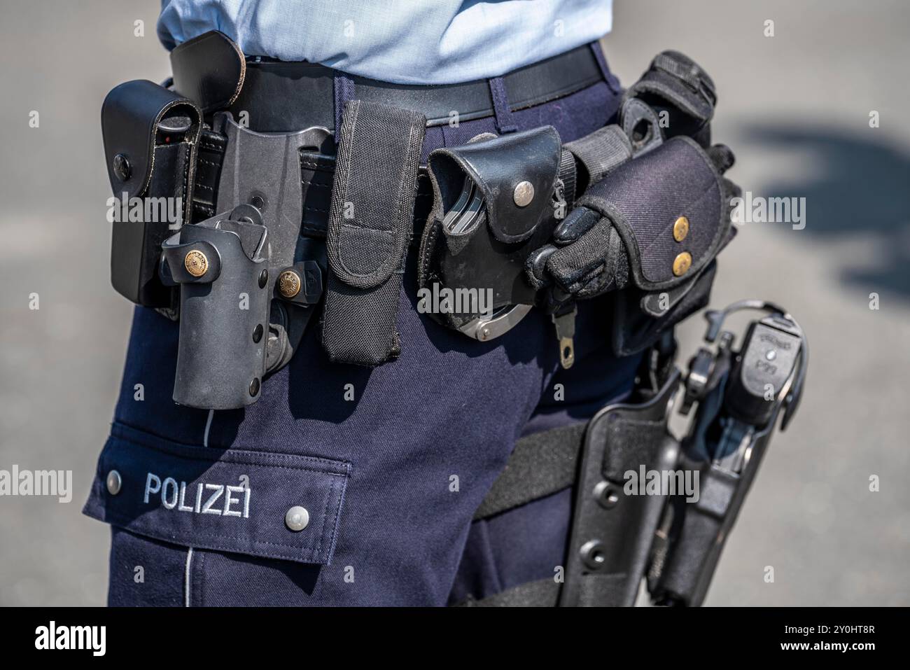 Police, police officer, policewoman, equipment belt with service weapon ...