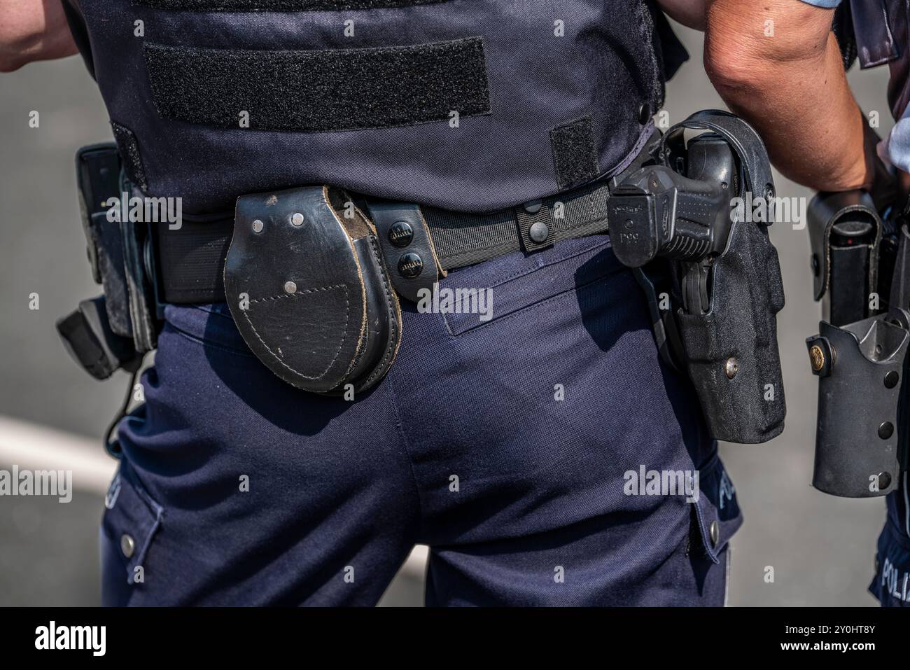 Police, police officer, policewoman, equipment belt with service weapon ...