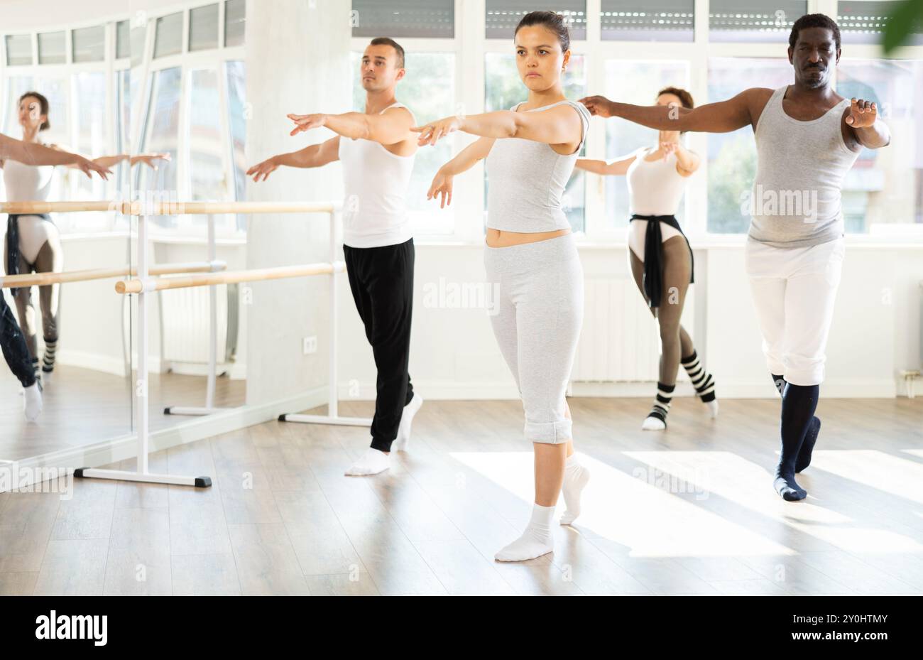 Asian woman enjoying ballet practice with group of amateurs Stock Photo ...