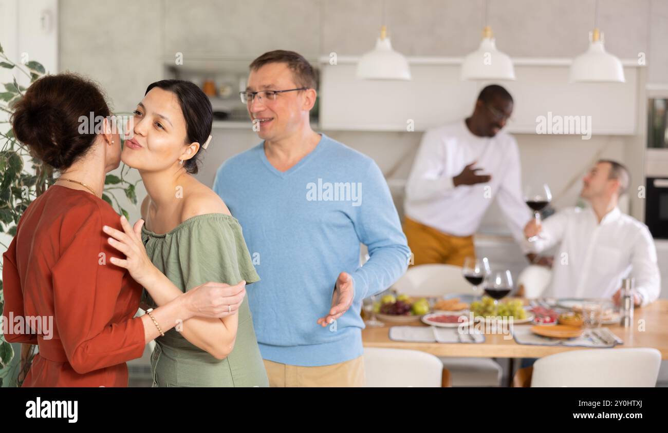 Women greeting each other with kiss hi-res stock photography and images ...
