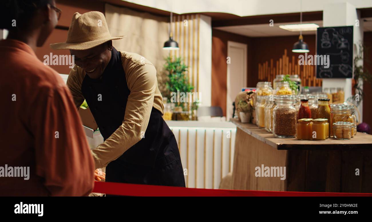 Small business owner opening local supermarket with new goods, greeting ...