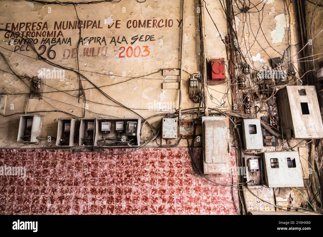 Cuba, Havana. Stucco, wood building, wiring and electrical boxes. 2016 ...