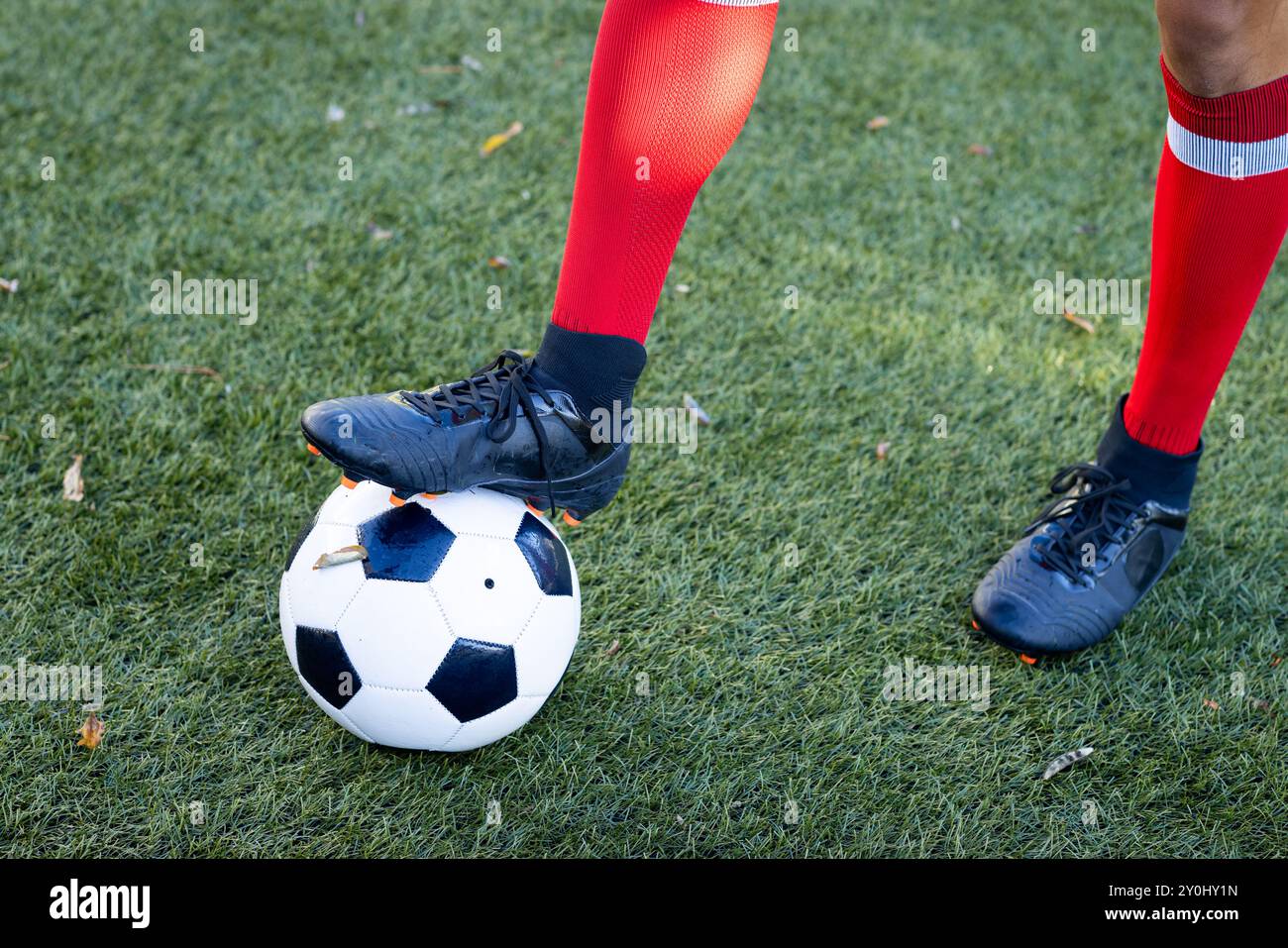 Soccer player kicking ball on field hi-res stock photography and images ...