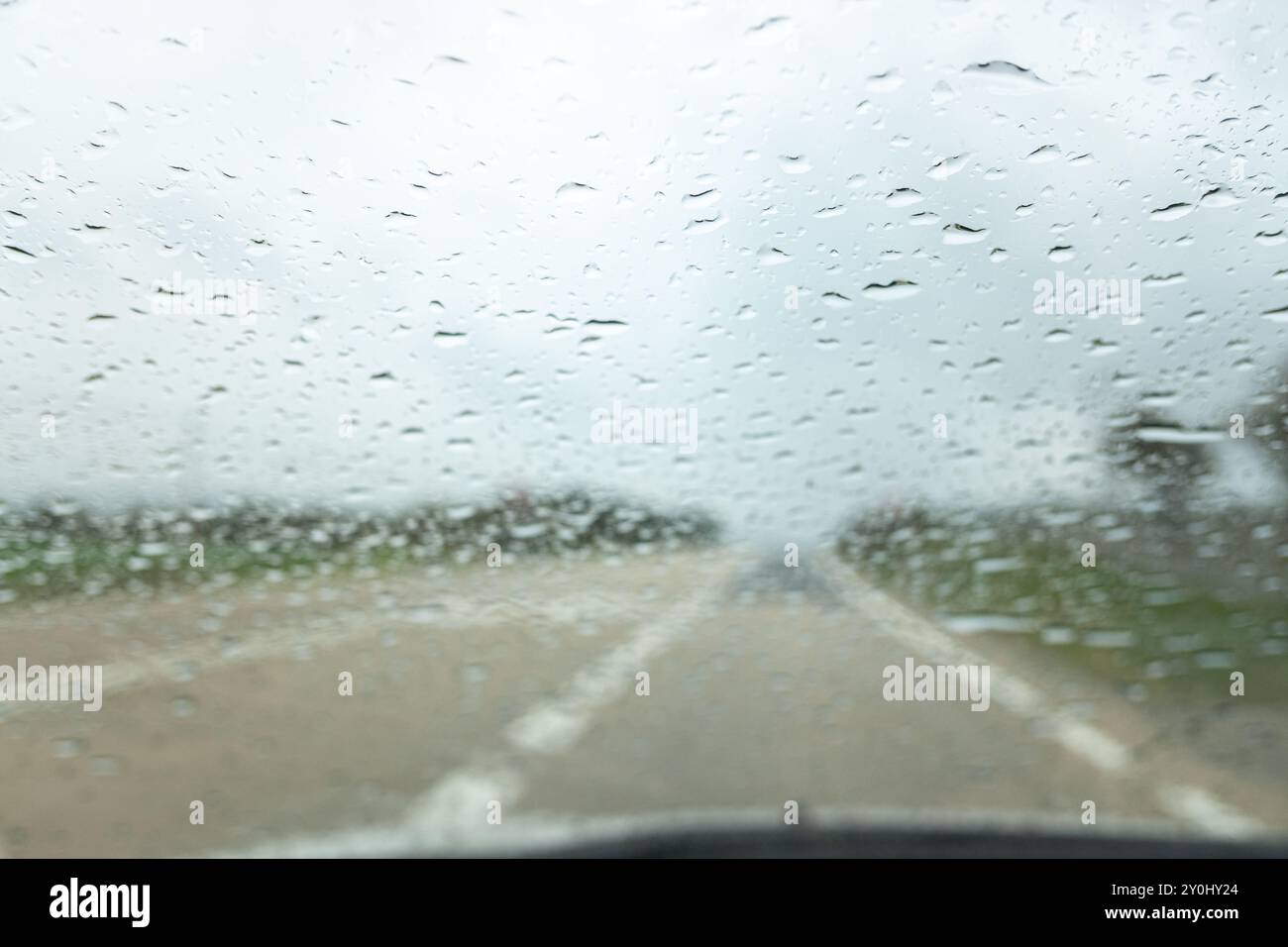 Rain falling on car windshield hi-res stock photography and images - Alamy