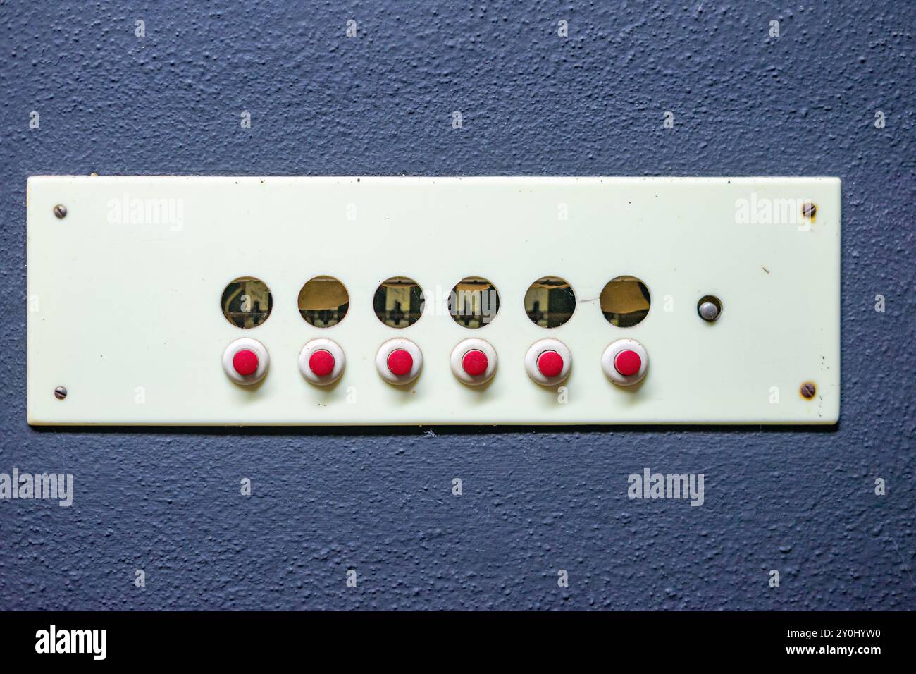 old box with 6 red buttons and holes where there were identification ...