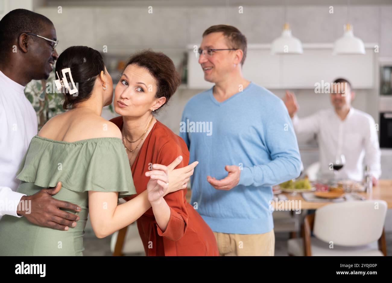 Group of friends greeting each other Stock Photo - Alamy