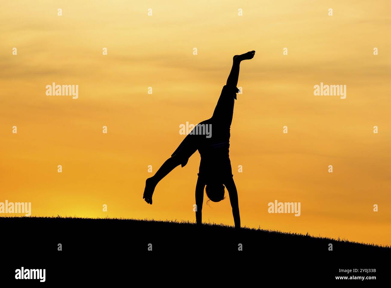 Cartwheel child hi-res stock photography and images - Alamy