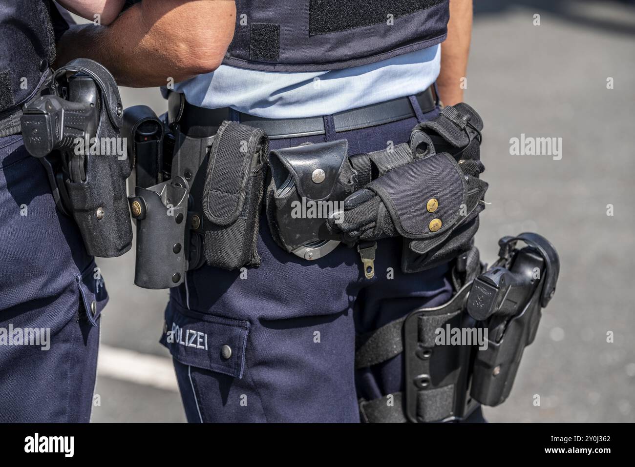 Police, police officer, policewoman, equipment belt with service weapon ...