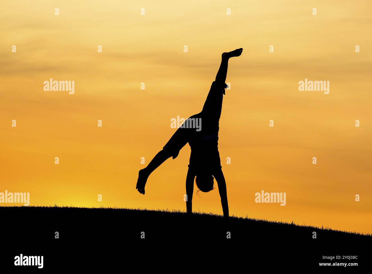 Girl cartwheel hi-res stock photography and images - Alamy