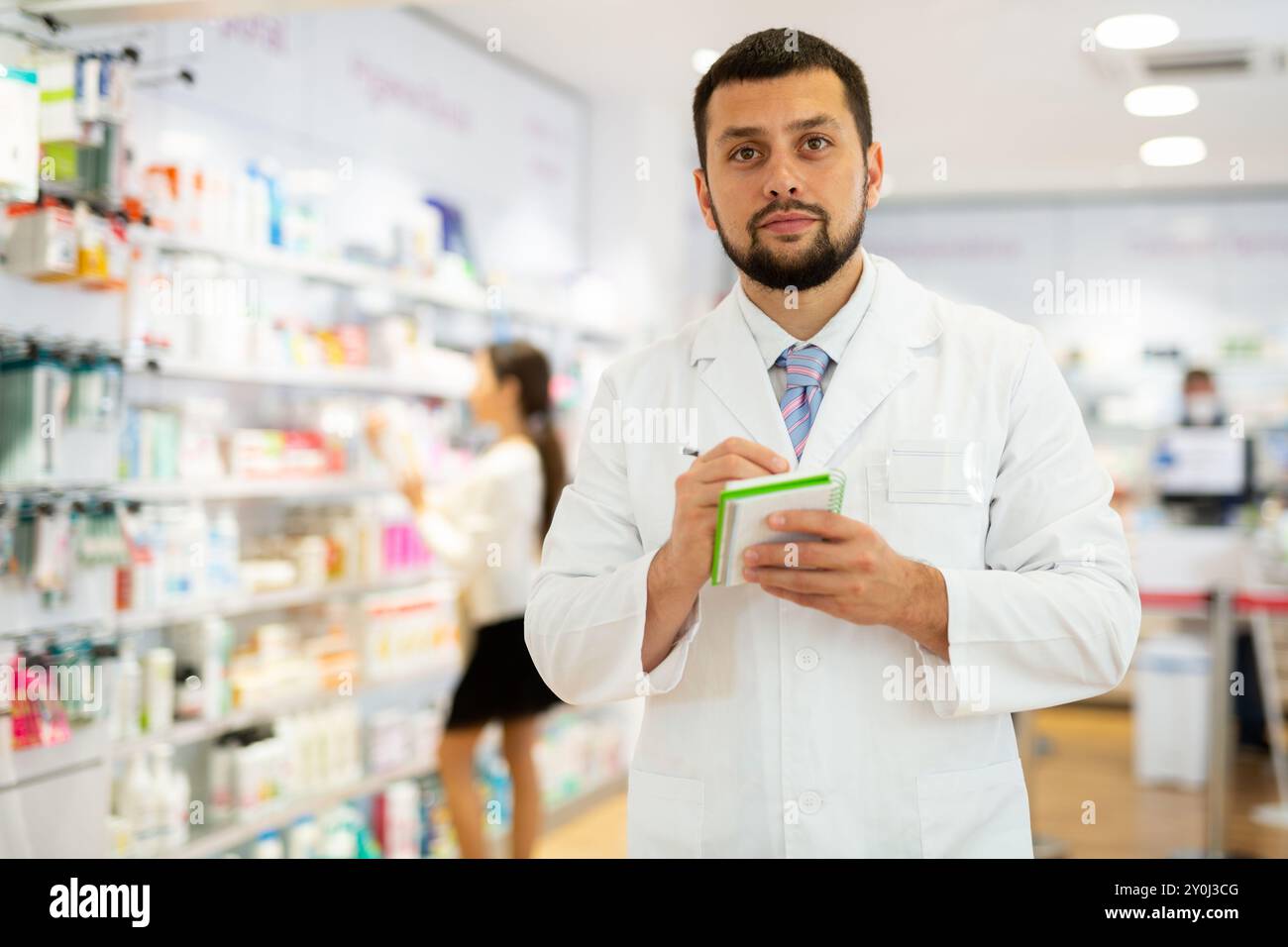 Male pharmacist checking assortment of drugs Stock Photo - Alamy