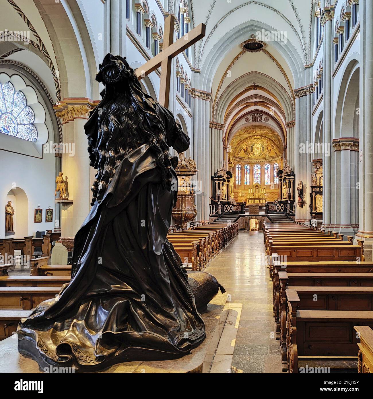 Interior view of Bonn Minster, bronze statue of St Helena with nave and ...