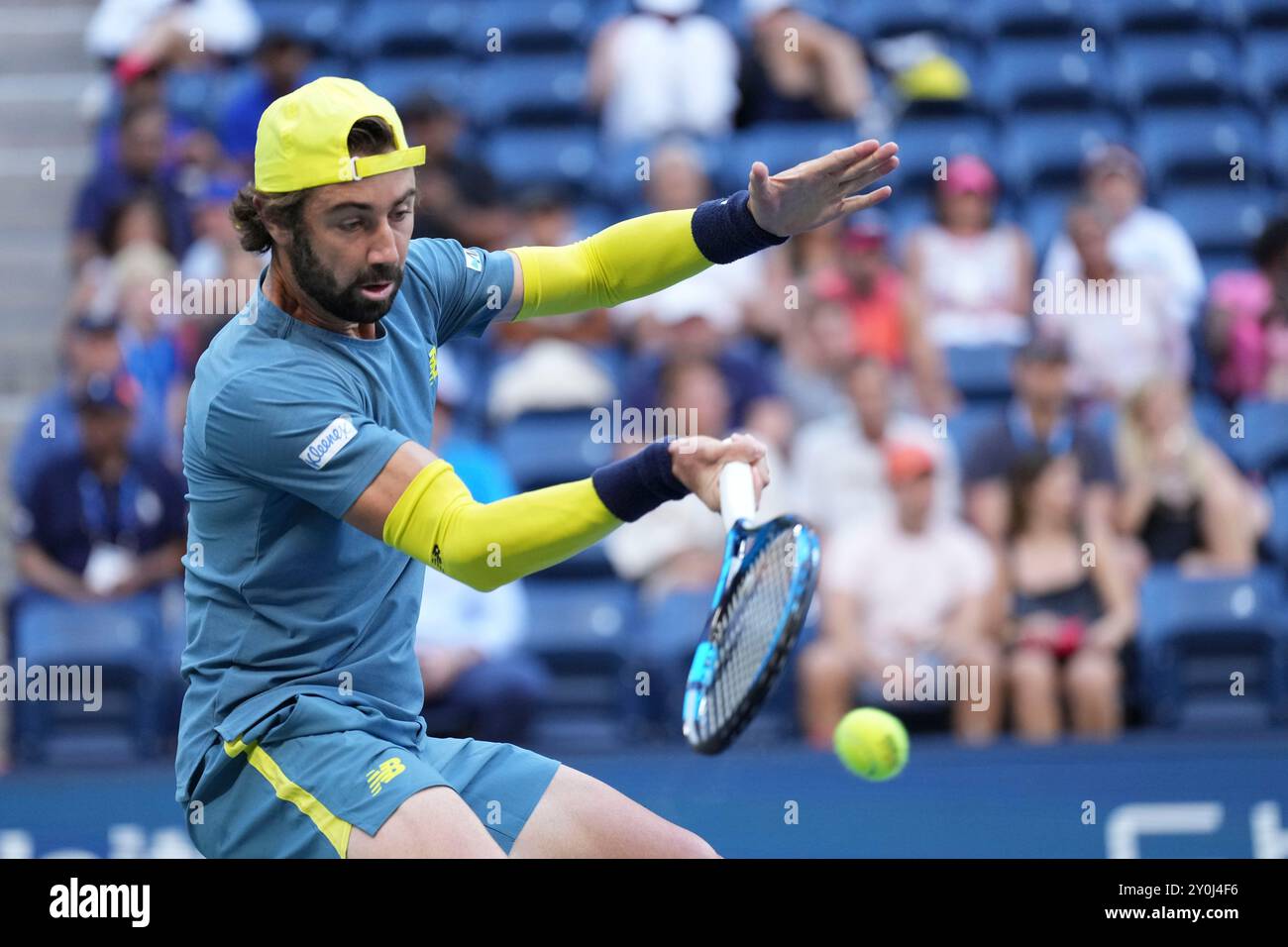 Jordan Thompson, of Australia, returns a shot to Alex de Minaur, of Australia, during a fourth ...